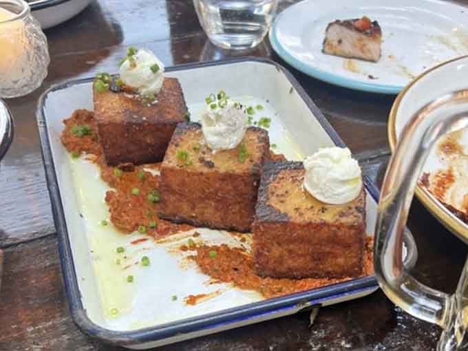 These crispy grit cakes are what happens when Southern tradition meets creative ambition, and everyone wins at that table.