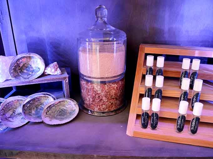 Abalone shells and essential oils arranged like tiny treasures, because even your post-session ritual deserves some elegance here.