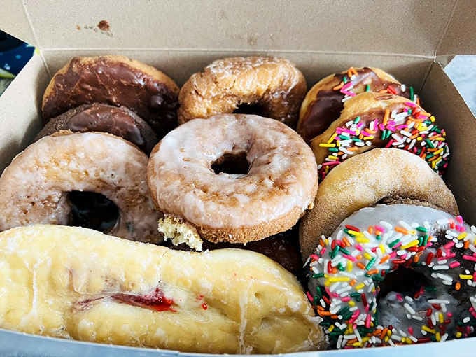 An assorted dozen that includes jelly-filled, sprinkles, and Boston cream because life's too short for boring breakfast choices, friends.