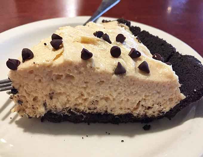 Peanut butter pie studded with chocolate chips on an Oreo crust is basically happiness served on a plate.