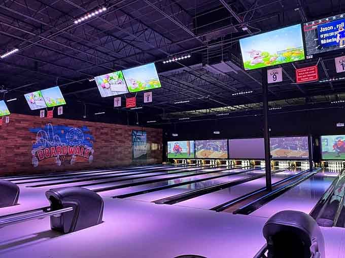 Purple bowling lanes glow like a disco decided to have a baby with a bowling alley, and we're all invited.