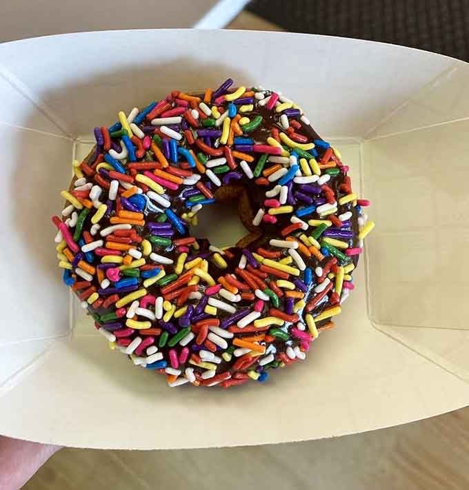 Rainbow sprinkles piled this high aren't just decoration &ndash; they're a lifestyle choice and possibly a cry for happiness.