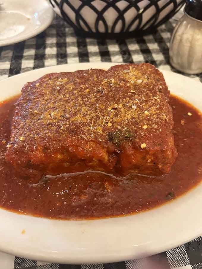 Lasagna that's clearly been doing squats because those layers are seriously stacked and ready to impress.