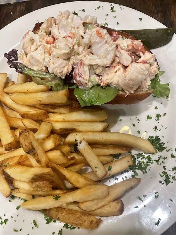 That lobster roll is stuffed so generously it makes you wonder if they understand the concept of portion control.