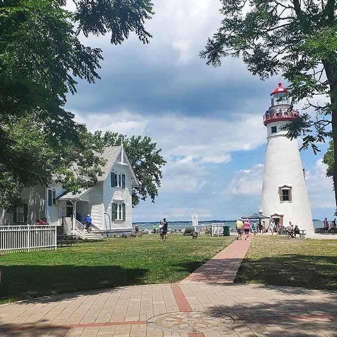Families stroll the grounds where keeper's families once lived, history meeting modern leisure on a perfect summer afternoon.