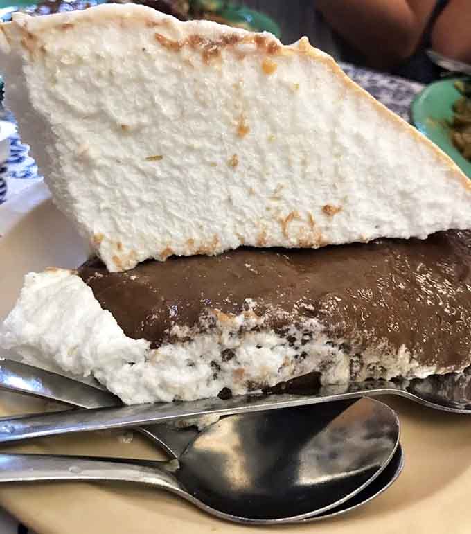 Towering slices of chocolate cream pie that look like they were engineered by dessert scientists who understand exactly what happiness tastes like.