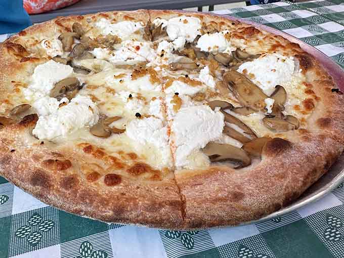 This white pie with mushrooms and ricotta is what happens when pizza decides to get fancy without being pretentious.