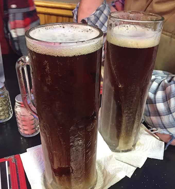 Root beer served in glasses so frosty they look like they've been waiting in Alaska for you.