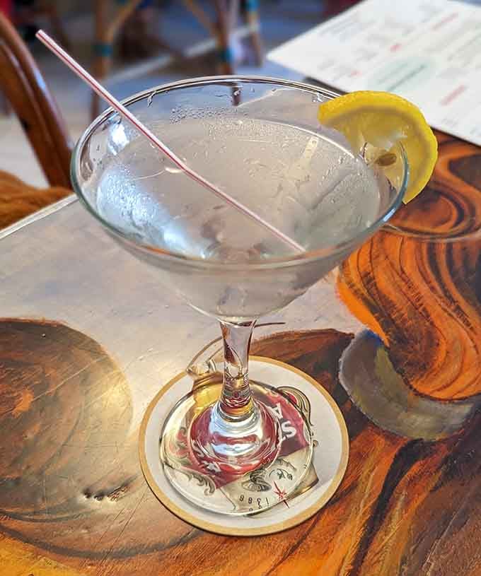 Even the martini looks crisp and inviting, because pizza deserves a proper companion at the table.