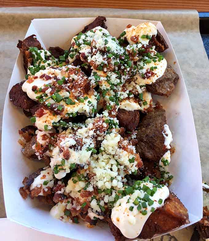 Fully loaded potato skins piled high with toppings that would make your grandmother's casserole blush with inadequacy feelings.