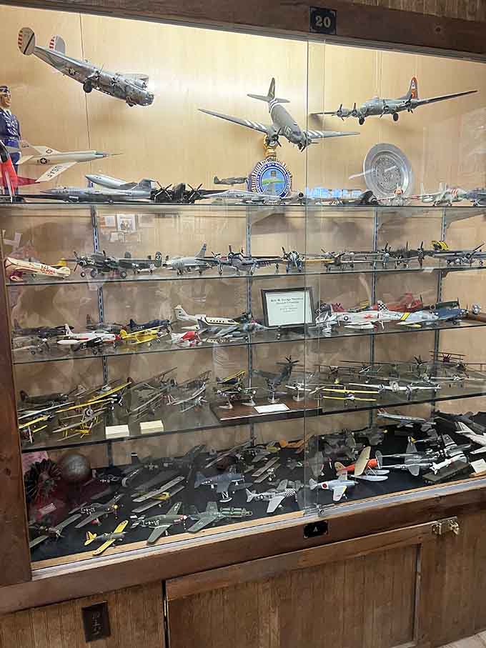 Military aircraft models soar above the displays, reminding us that transportation history took to the skies too.