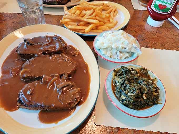 Meatloaf swimming in gravy alongside mashed potatoes, proving comfort food is a legitimate food group.