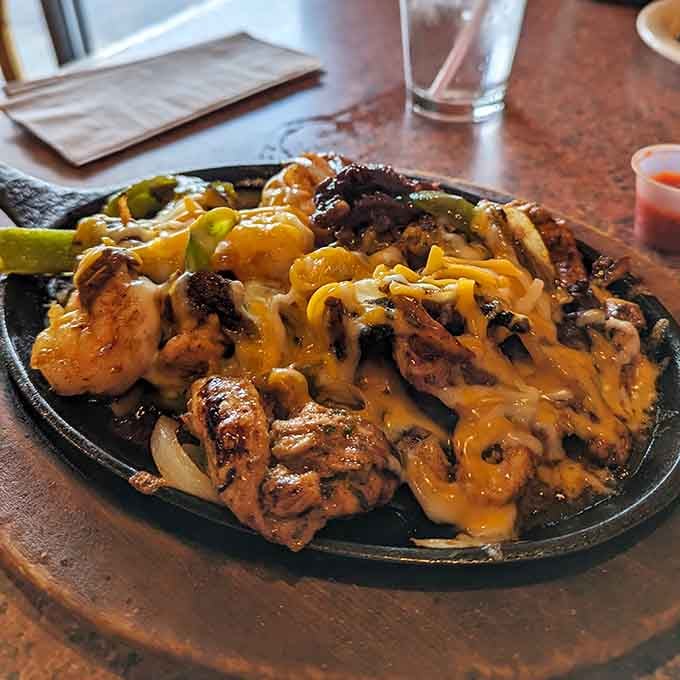 That sizzling skillet announces its arrival like a mariachi band, and the Jack Daniel's fajita delivers on every promise.