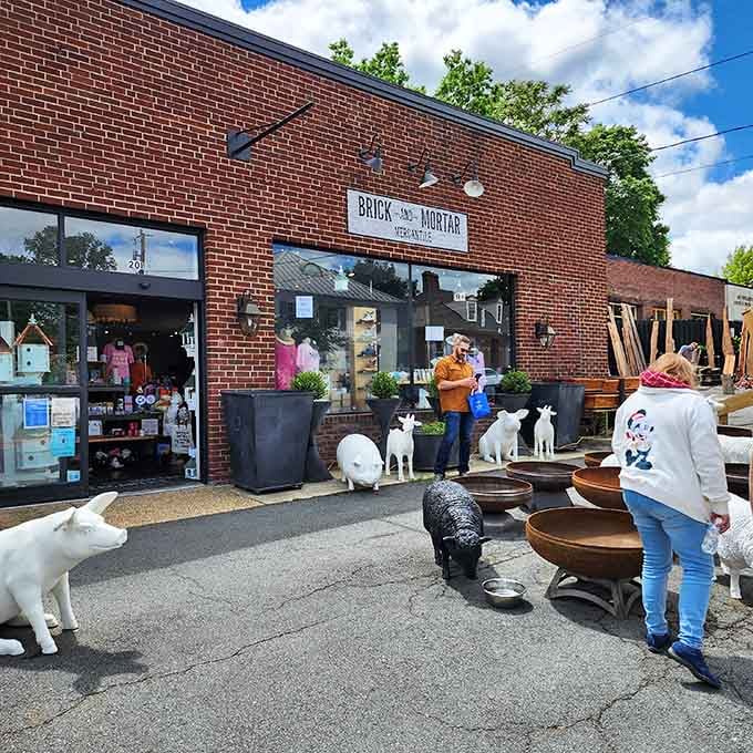 Brick and Mortar Mercantile's quirky outdoor display featuring animal statues suggests the fun continues inside, where whimsy meets vintage perfectly.