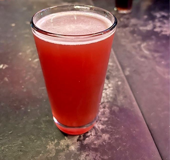 Ruby-red and refreshing, this craft brew catches the light like a liquid sunset waiting to quench your thirst beautifully.