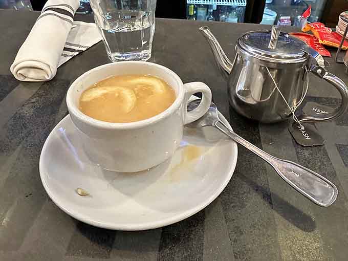 Espresso served properly with extra hot water on the side, because details matter when caffeine's involved.