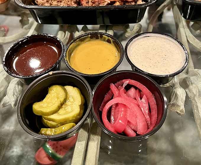 A rainbow of sauces and pickles, because variety is the spice of barbecue life.