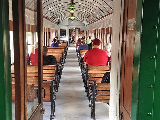 Wooden benches and open windows remind us that comfort once meant fresh air, not climate-controlled isolation chambers.