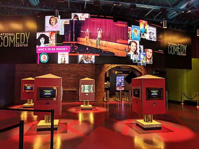 Those bright red interactive kiosks are like comedy jukeboxes, except instead of songs you're selecting laughs from different eras and styles.