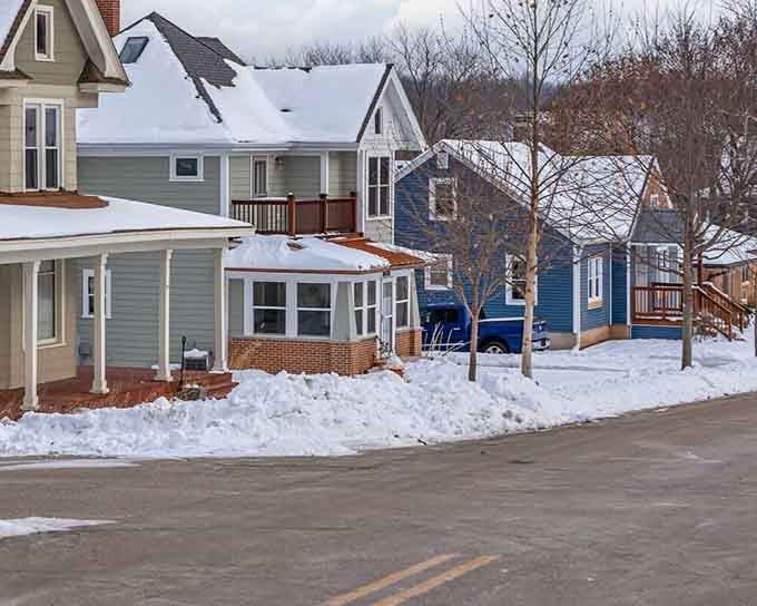 Residential streets showcase charming homes where Swiss style meets Wisconsin winters with grace and character.