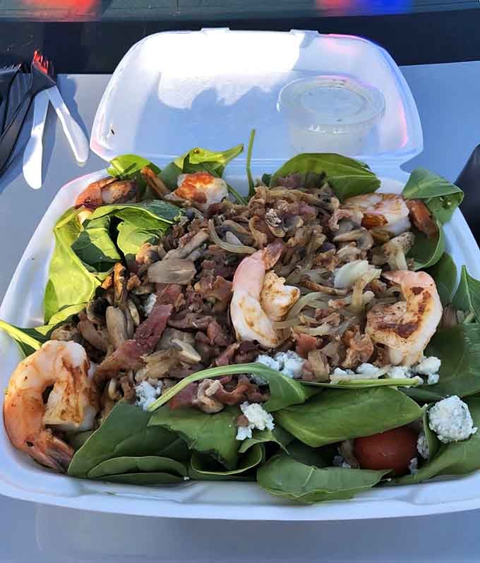 This isn't your sad desk salad; it's a spinach creation topped with perfectly seasoned shrimp that actually constitutes a meal.