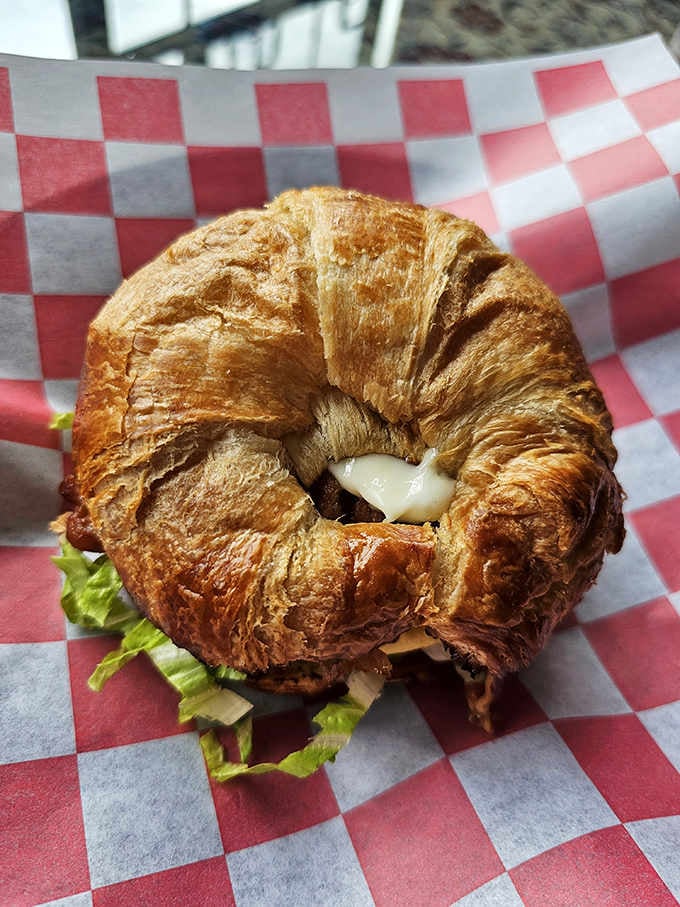 That flaky croissant holds together a breakfast masterpiece that'll make you reconsider everything you thought about sandwiches.