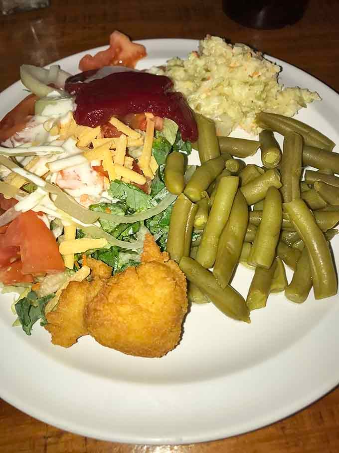 That salad's trying its best, but let's be honest, it's just making room for round two.