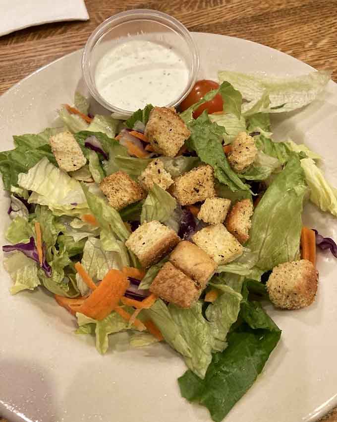 Even the side salad gets dressed up with croutons, because vegetables deserve a little excitement too.