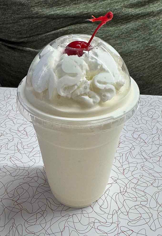 Thick, creamy vanilla shake crowned with whipped cream and a cherry because some traditions should never change.