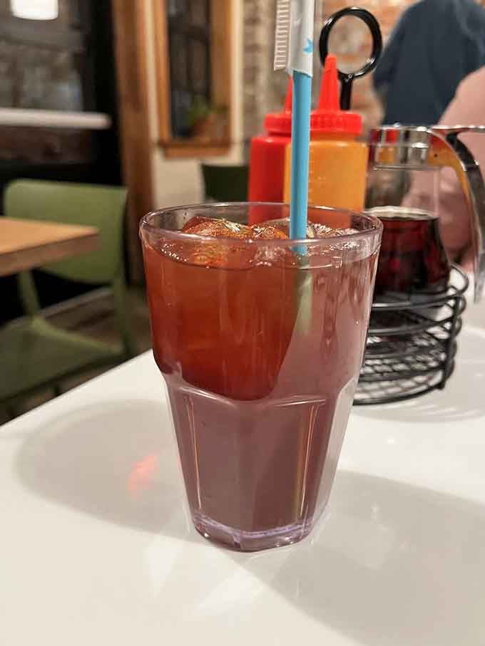 Sweet tea in a tall glass with that blue straw brings back memories of front porch summers and simpler times.