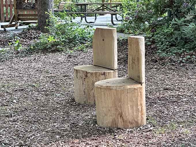 Hand-carved wooden seats invite kids to rest their legs while imagining they're forest creatures taking a break.