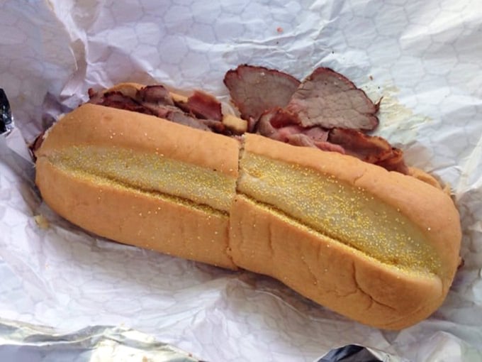 That sub roll is working overtime to contain all that smoky, tender meat, and honestly, we respect the effort.