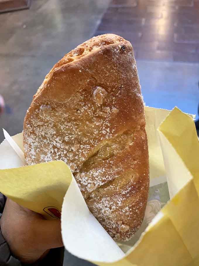 Dusted with cinnamon sugar like it just walked through a delicious snowstorm, this half-moon promises sweetness in every single bite.