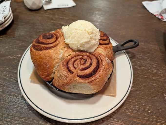 Cinnamon rolls arrive warm with butter, looking like edible clouds topped with sweet, creamy heaven.