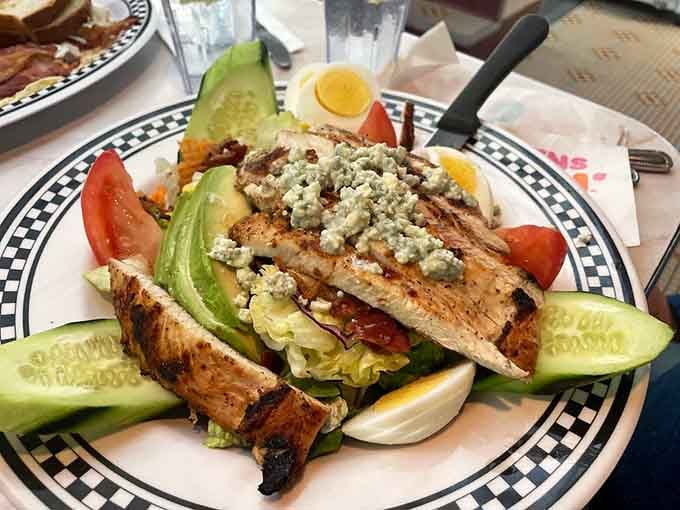 This Cobb salad brings grilled chicken, blue cheese, and fresh vegetables together in one photogenic, fork-ready masterpiece.