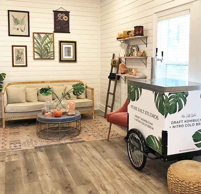 The lobby's farmhouse-chic vibe with that kombucha cart suggests someone here really understands the whole wellness lifestyle thing.