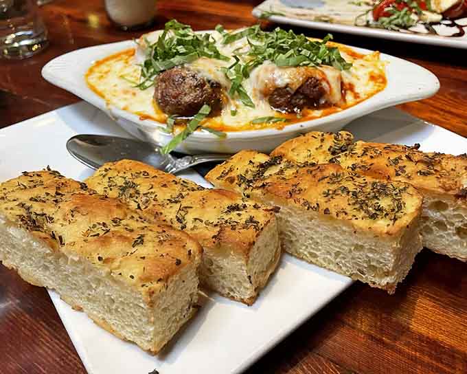 Meatballs and focaccia make the perfect opening act before the main pizza event steals the show completely.