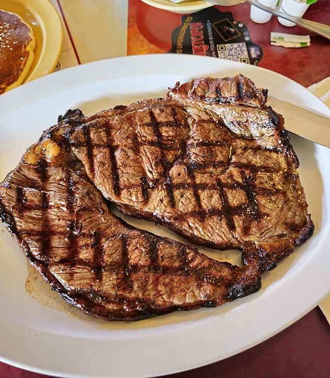 These sirloin steaks show perfect grill marks like a culinary report card, and they're clearly getting straight A's in flavor class.