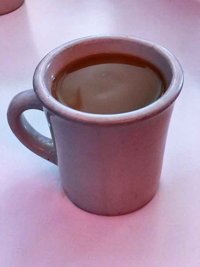 Simple coffee in a classic mug, proving that some pleasures don't need fancy Italian names to satisfy.