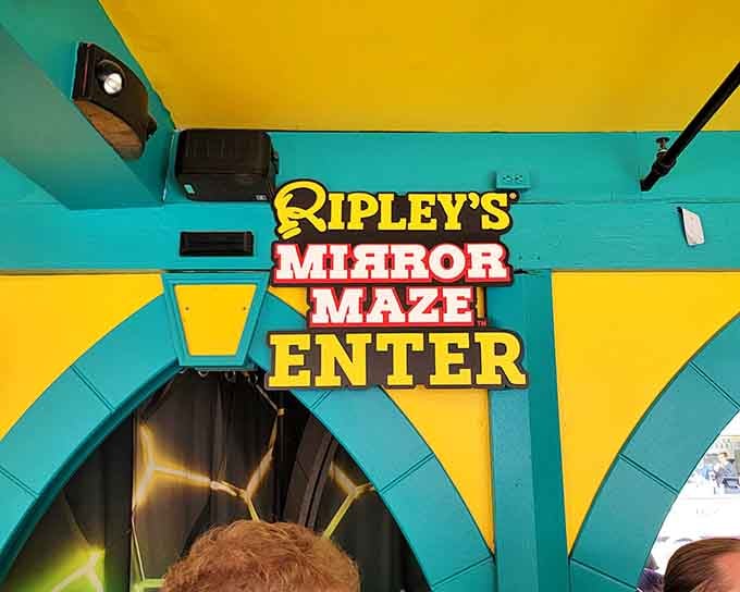 The entrance sign practically vibrates with neon energy, daring you to step inside and get wonderfully lost.