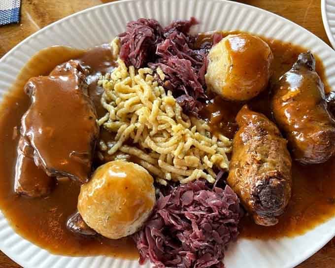 Rouladen, sauerbraten, spaetzle, red cabbage, and gravy create a plate that looks like Oktoberfest decided to throw a party.