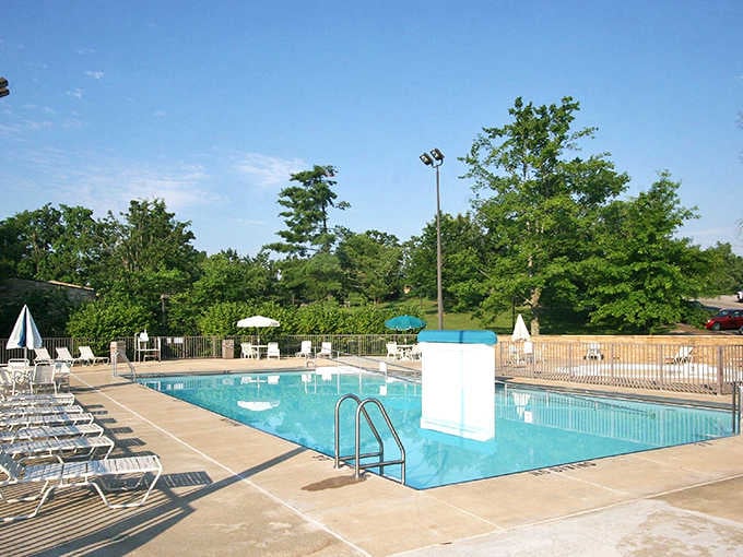 That classic pool beckons with crystal-clear water, white lounge chairs, and the promise of cannonball contests to come.