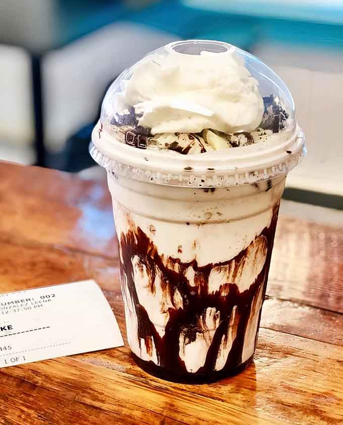 This Oreo milkshake with chocolate drizzle and whipped cream is basically dessert therapy in a cup you can't refuse.