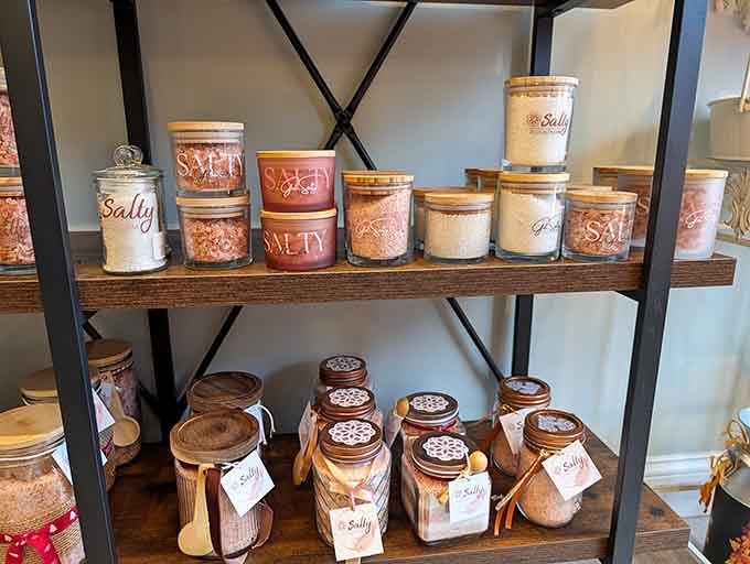 Handcrafted salt scrubs line the shelves like little jars of self-care waiting to transform your bathroom routine.