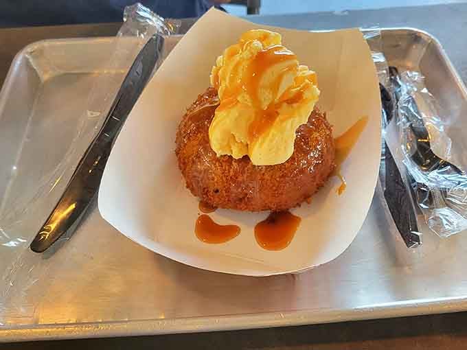 Pineapple cake topped with whipped cream and caramel drizzle, the sweet finale your barbecue feast absolutely deserves.