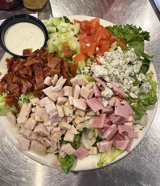 A Cobb salad loaded with enough protein to justify calling it a meal, not just rabbit food.