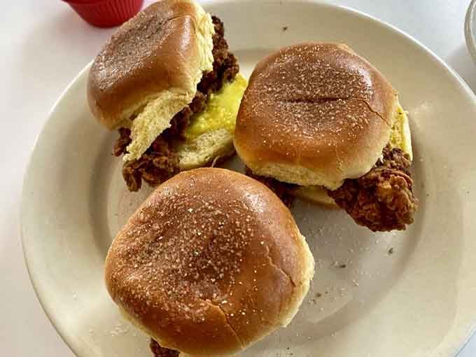 Golden tater tots alongside a loaded burger create the kind of combo meal that makes you question why anyone pays double elsewhere.