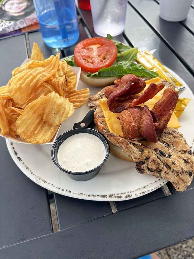 Grilled chicken with bacon, cheese, and all the fixings proves barbecue joints can do sandwiches right too.