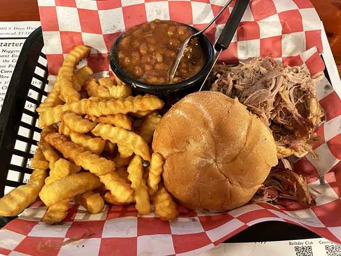 Pulled pork piled high on a soft bun with crispy fries is comfort food at its absolute best.