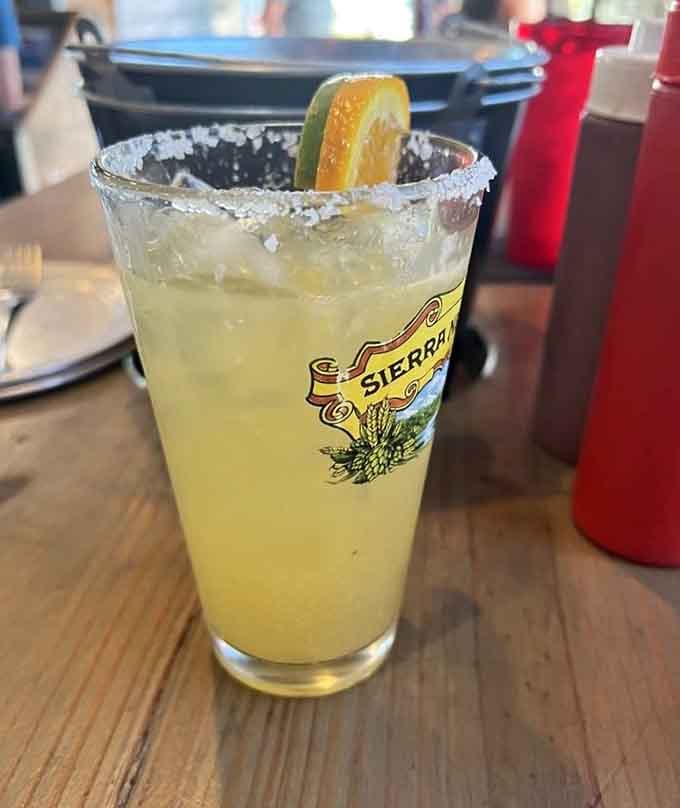 A perfectly salted margarita that tastes like vacation in a glass, complete with citrus garnish.